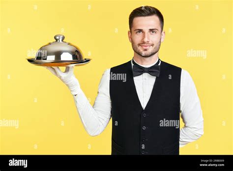 Handsome Elegant Waiter Holding Tray And Cloche Ready To Serve On