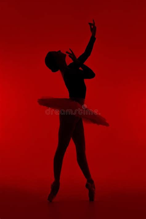 Beautiful Silhouette Of Ballerina On Red Background Dancing Ballet