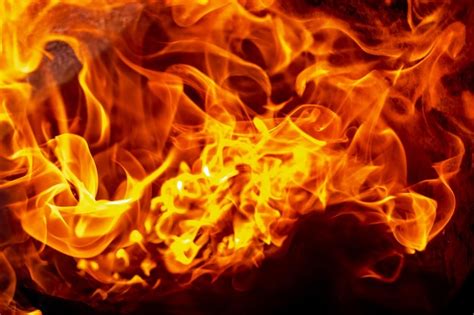 Premium Photo Burning Fire Close Up Bright Orange And Red Flames On A