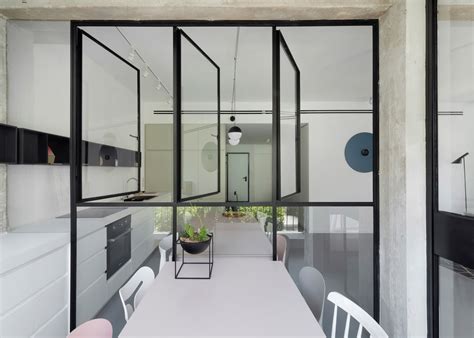 Thin Black Frames Draw The Eye Around A Renovated Tel Aviv Apartment