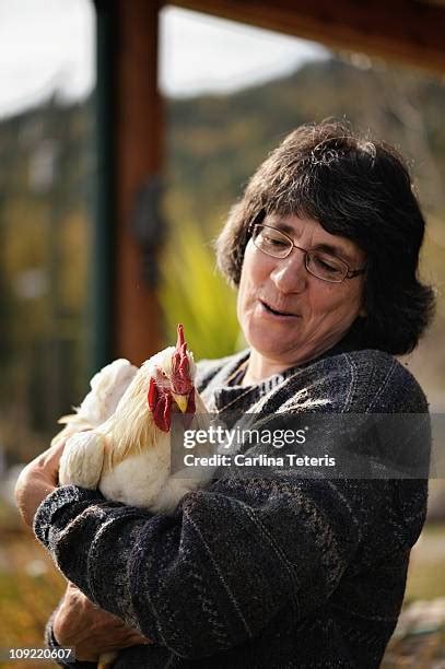 Woman Holding Rooster Photos And Premium High Res Pictures Getty Images