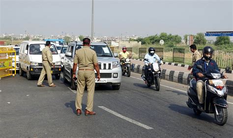 Police Personnel Check Ids And Passes Of Commuters See Pics