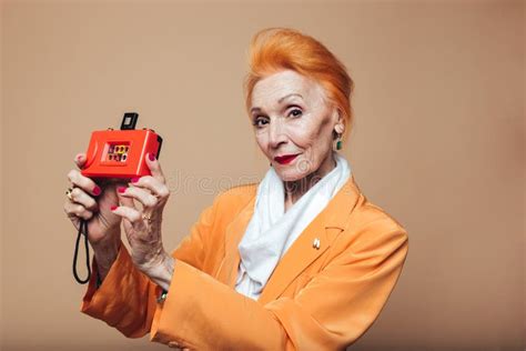 Mature Redhead Fashion Woman Standing Isolated At Studio Stock Image