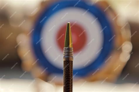 Premium Photo Sharp Arrow Tip With Rich Blurry Target In The Background