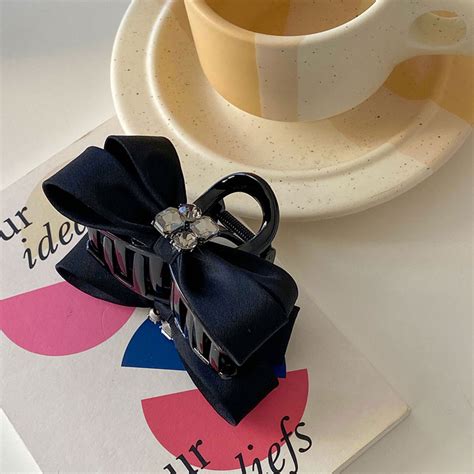 마르엔 큐빅 블랙 리본 집게핀 아이디어스