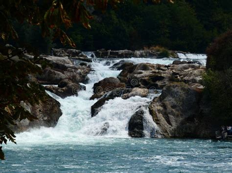 Tranquil Mountain River Cuts Through A Rocky Valley Creating A