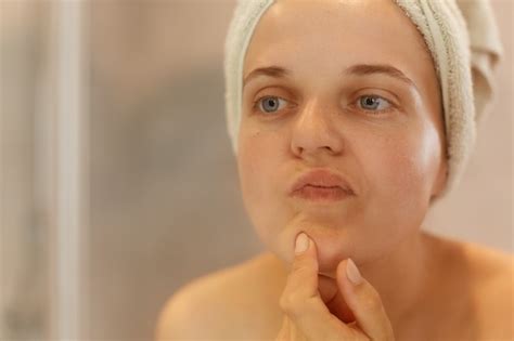Free Photo Closeup Portrait Of Beautiful Woman Looking At Her Face