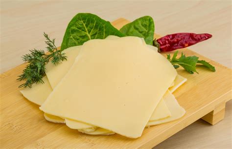 Sliced Sheese On Wooden Board And Wooden Background 12630818 Stock