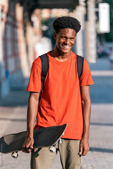Portrait Of Handsome Afro Man Looking At Camera By Stocksy