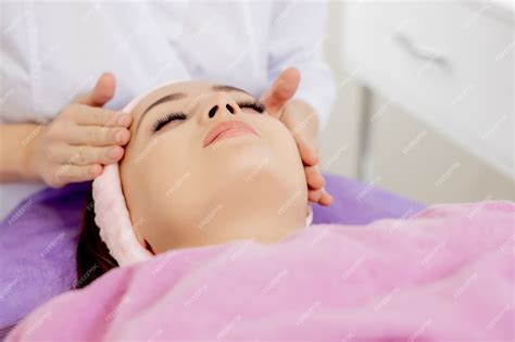 Premium Photo Face Massage Close Up Of Young Woman Getting Spa Massage Treatment At Beauty