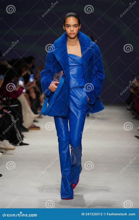 A Model Walks The Runway At The Genny Fashion Show Editorial