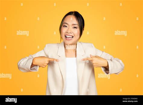 Confident Asian Woman Pointing Finger At Herself Self Assured And Bold