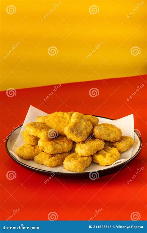 Delicious Golden Chicken Nuggets On A Plate On The Table Fast Food
