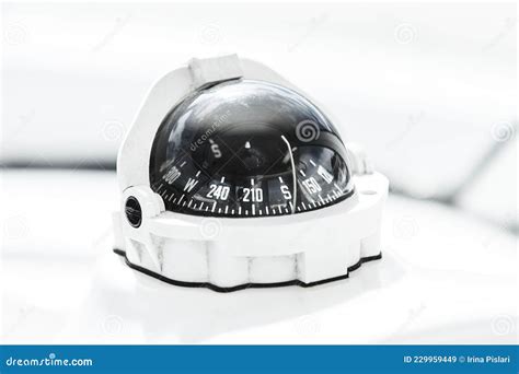 A Big Compass On A Boat Showing Direction Harbor Background Royalty