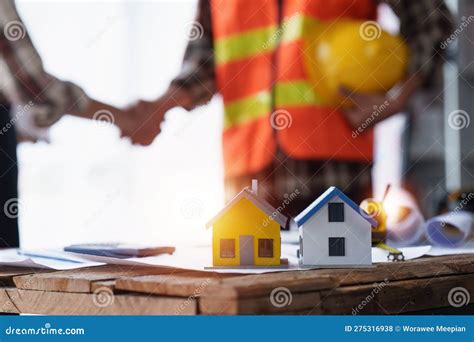 Architect And Engineer Working With Blueprints For Architectural Plan Engineer Sketching A