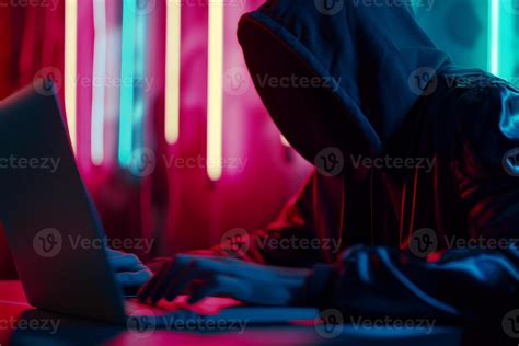 Fashionable Anonymous Hacker Typing Computer Laptop Cybercrime