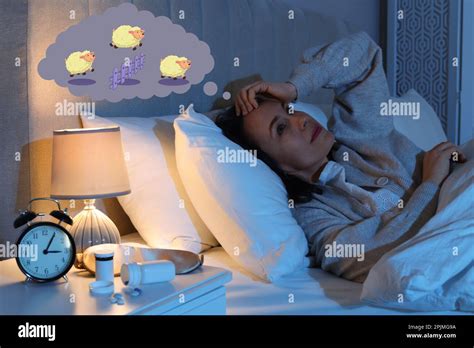 Mature Woman Trying To Fall Asleep Counting Sheep In Bed At Night Stock