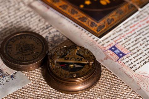 Old Vintage Brass Compass With Sundial Lying On A Very Old Medival Hand