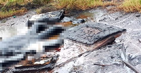 La historia detrás del macabro video que muestra a un cadáver en un pozo de brea y que se