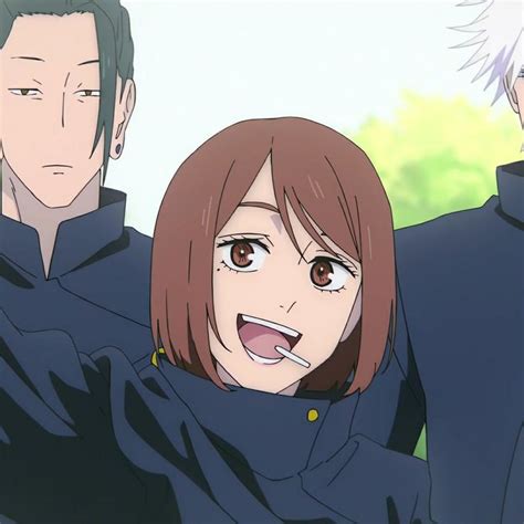 Two Anime Characters Are Standing Next To Each Other And One Is Holding Something In His Mouth