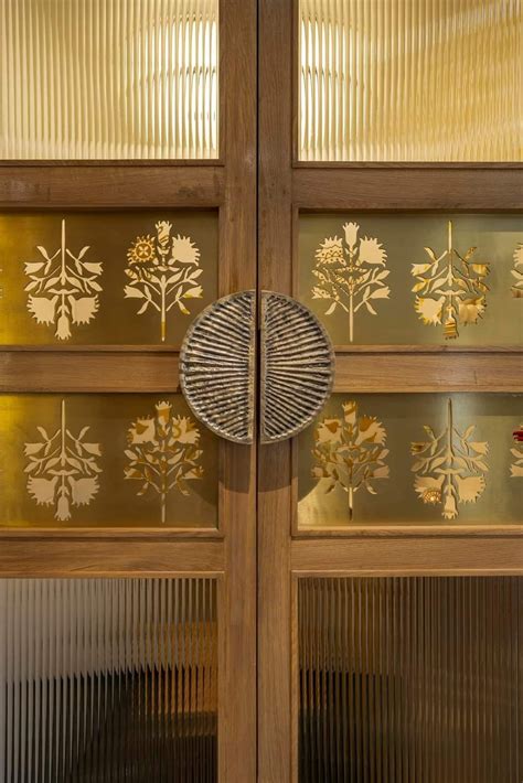Intricately Designed Wooden Door With Glass Panels