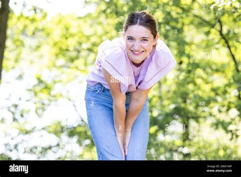 This Image Captures A Young Woman In Casual Summer Attire Leaning