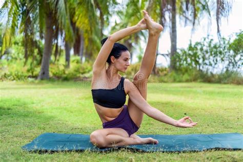 Compass Pose Or Surya Yantrasana Yoga With Ukrainian Woman Making It Outdoors Stock Image