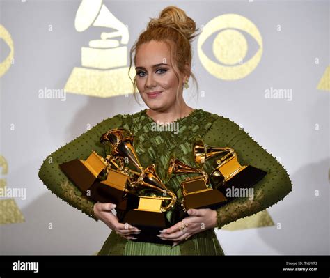 Singer Adele Appears Backstage With Her Awards For Album Of The Year