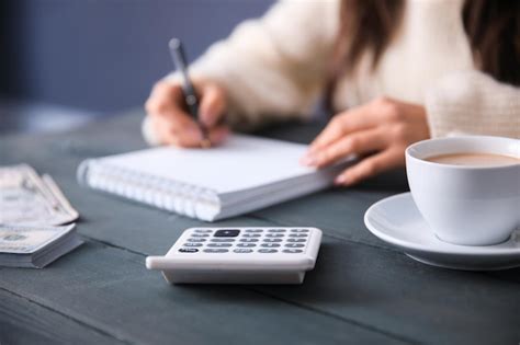 Premium Photo Woman Hand Notepad With Calculator