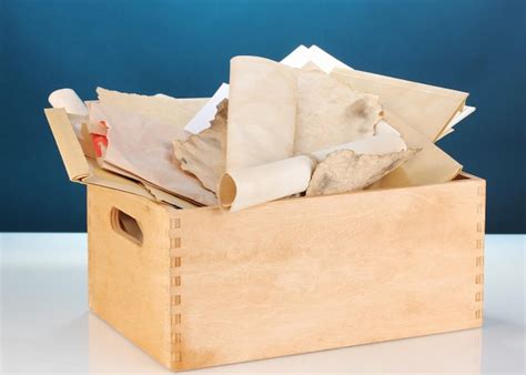 Premium Photo Wooden Crate With Papers And Letters On Blue Background