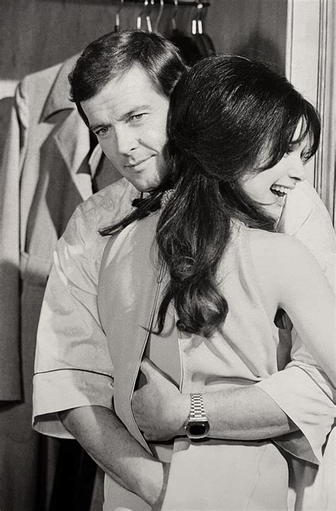 Bid Now Terry Oneill Roger Moores Bond Shares An Intimate Embrace