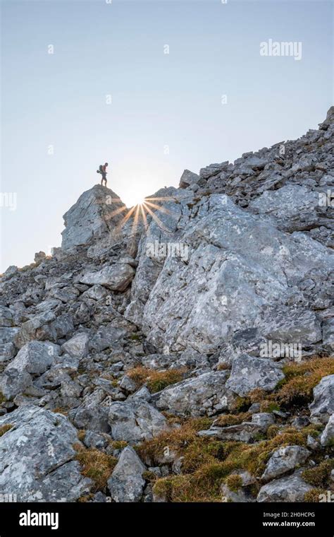 Hiker Standing On A Rock Scree Hiking To The Hochkalter