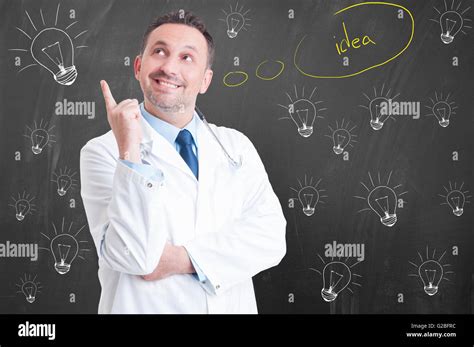 Cheerful Young Medic In White Labcoat With Idea Bubble Near His Head