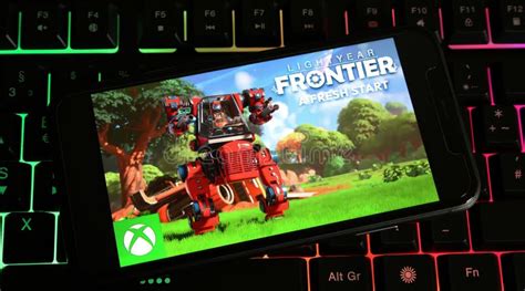 Closeup Of Smartphone On Pc Keyboard With Logo Lettering Of Lightyear