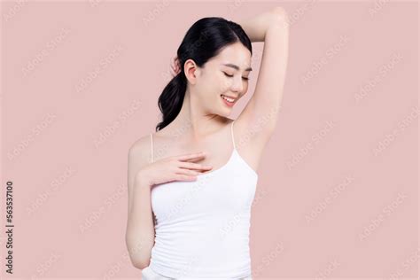 Beautiful Young Asian Woman Lifting Hand Up To Shows Off Clean And