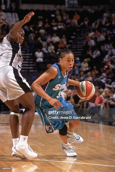 Dawn Staley Of The Charlotte Sting Drives Against Marie Ferdinand Of News Photo Getty Images