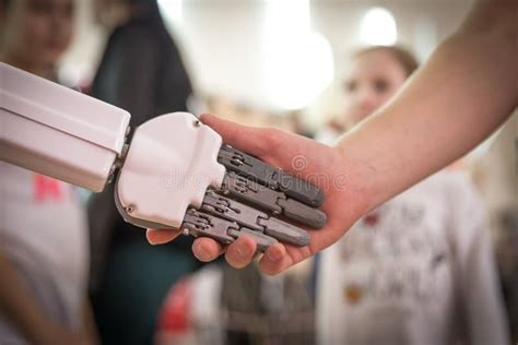 Man And Robot Shaking Hands Concept Of Human Interaction With Artificial Intelligence Stock