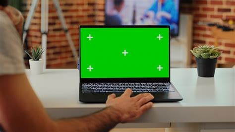Premium Photo Male Employee Working With Laptop And Greenscreen