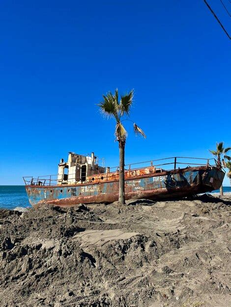 Premium Photo Old Rusty Ship On A Sandy Beach