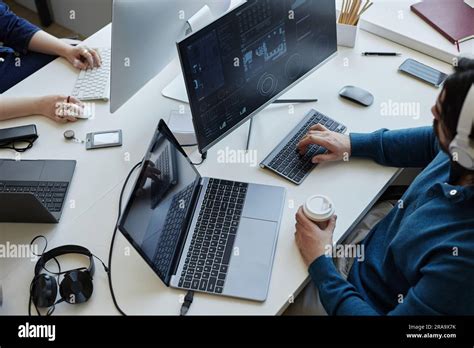 Above View Of Laptop And Monitor Of Desktop Computer With Data On
