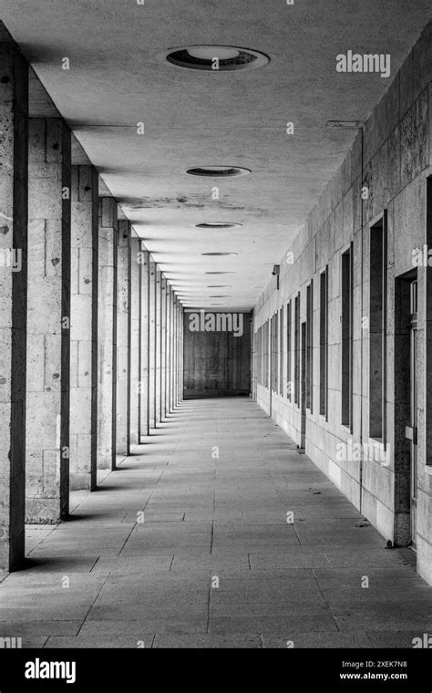 A Vanishing Perspective View Of A Modern Arcade With Evenly Spaced
