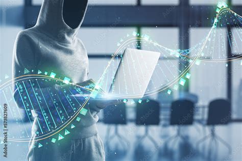 Hacker Using Laptop With Glowing Binary Code Dna Helix On Blurry Office