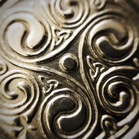 Premium Photo Full Frame Shot Of Triskele Pattern On Metal
