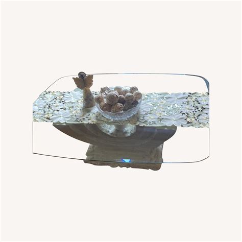 Artistic Glass Rests Upon A Solid Sculpture Aptdeco