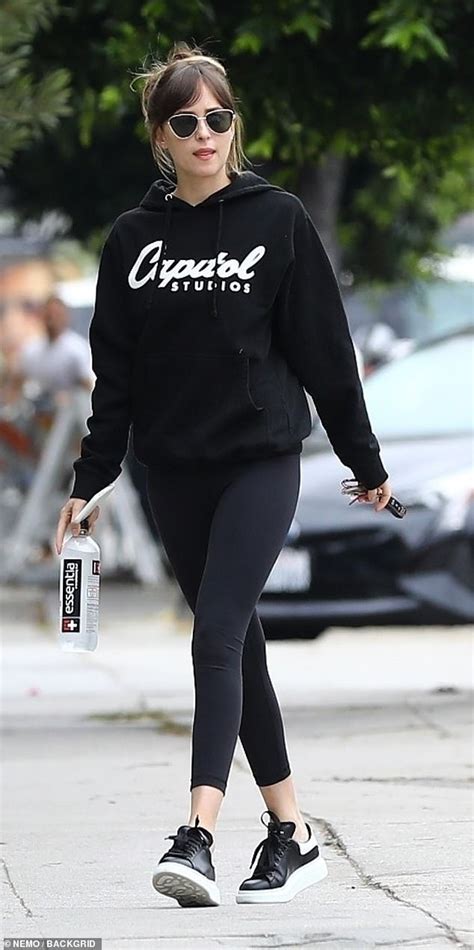 Dakota Johnson Shows Off Her Lithe Figure In Hoodie And Leggings As She