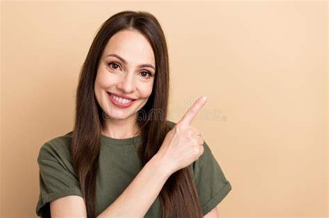 Portrait Of Mature Lady Wear Khaki T Shirt Directing Finger Novelty