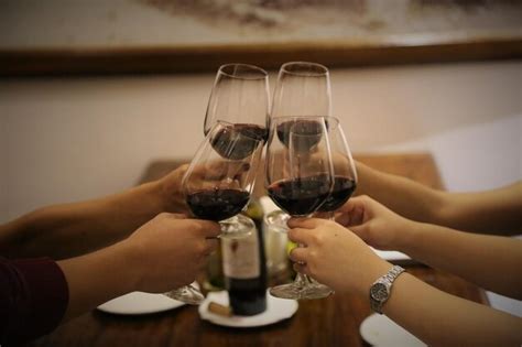 Premium Photo Cropped Hands Of People Toasting Red Wine At Restaurant