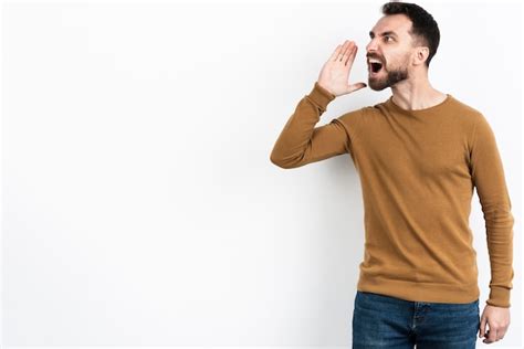 Free Photo Man Shouting While Looking Away