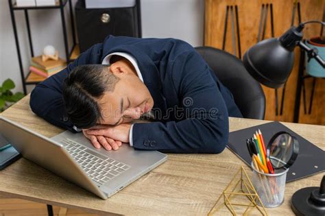 Bored Sleepy Business Man Worker Working On Laptop Leaning On Hands Falling Asleep At Office