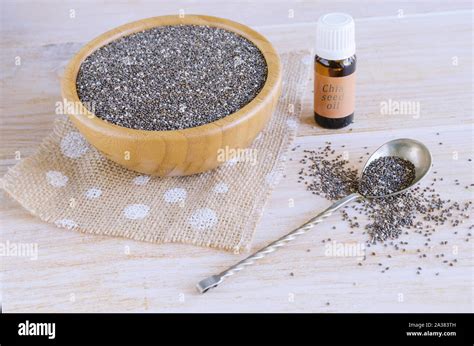 Superfood Chia Seeds And Chia Seed Oil On Wooden Table Salvia